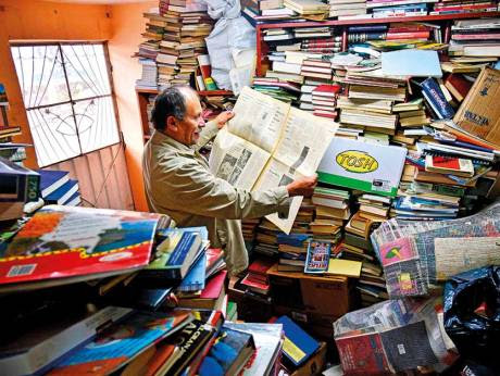 Garbage collector creates library out of thrown books | The Filipino Times