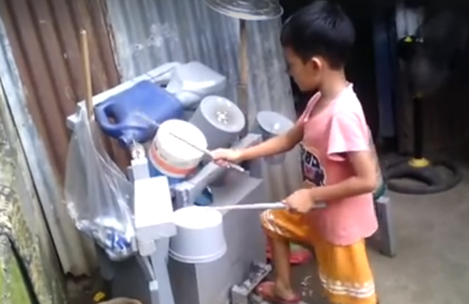 VIRAL: Little drummer boy plays using improvised drum set | The ...