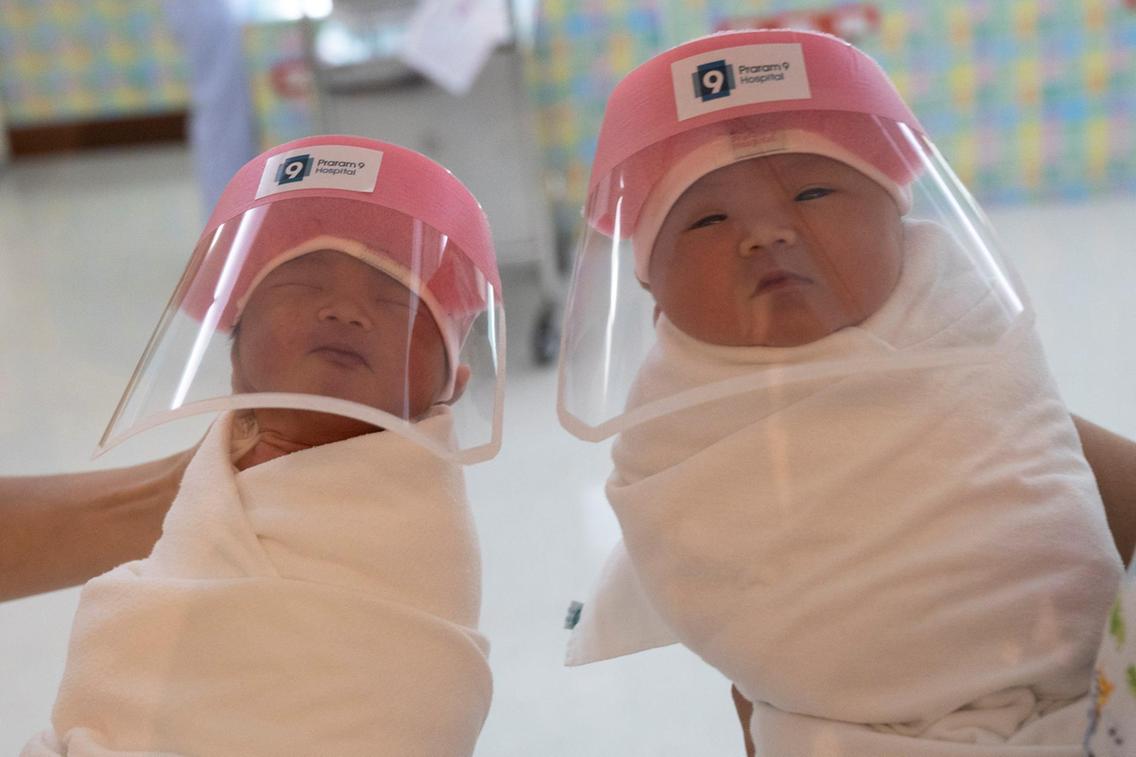 Newborn babies in Thailand go viral with their tiny COVID-19 face ...