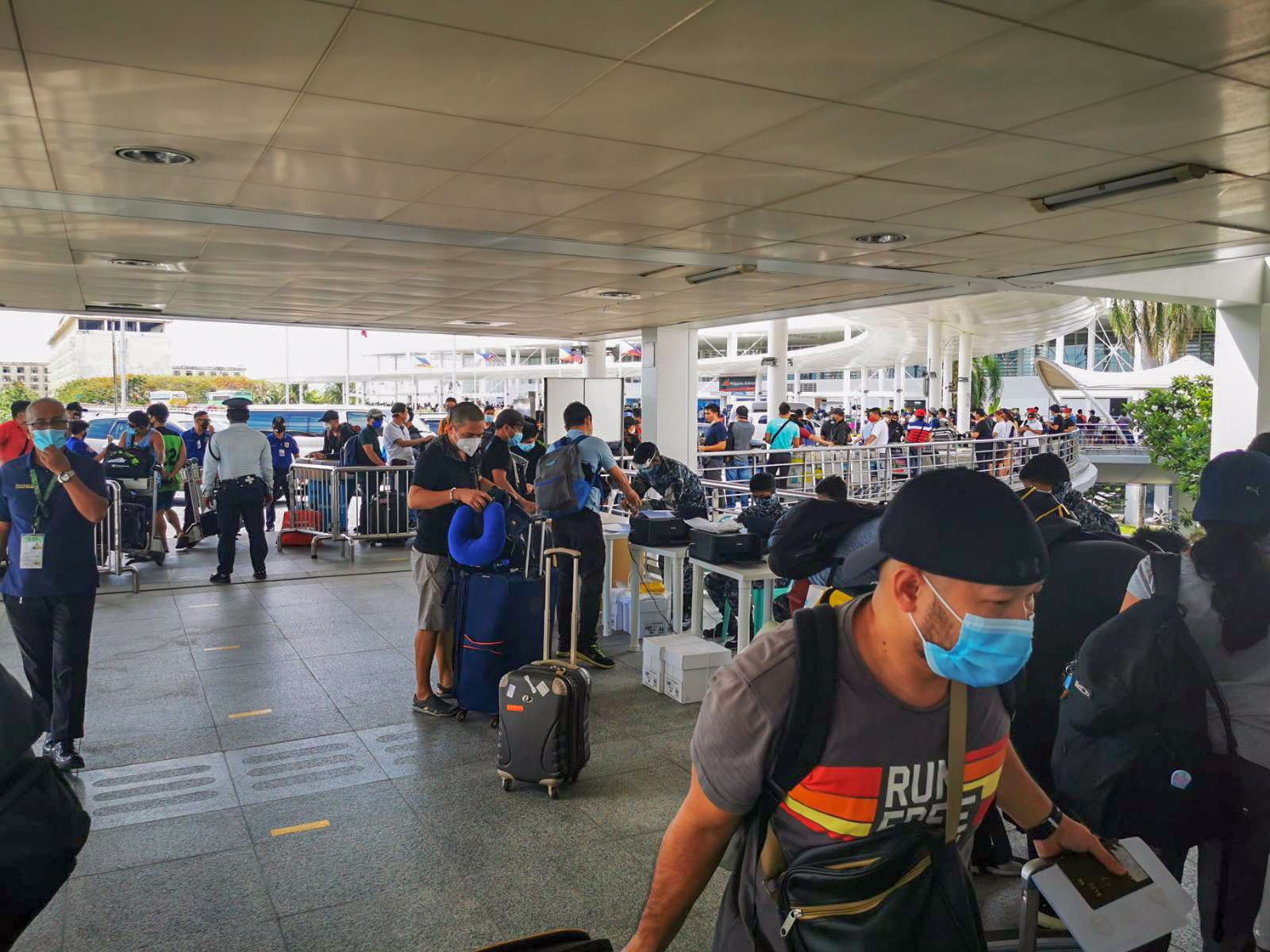 Overseas Filipinos arriving in PH now only have to take one PCR test ...