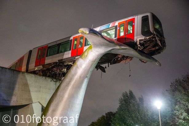 Metro train that crashed off tracks gets saved by large sculpture - The ...