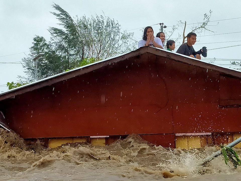 LOOK: Floods, lahar flow force Filipino families seek safety due to ...